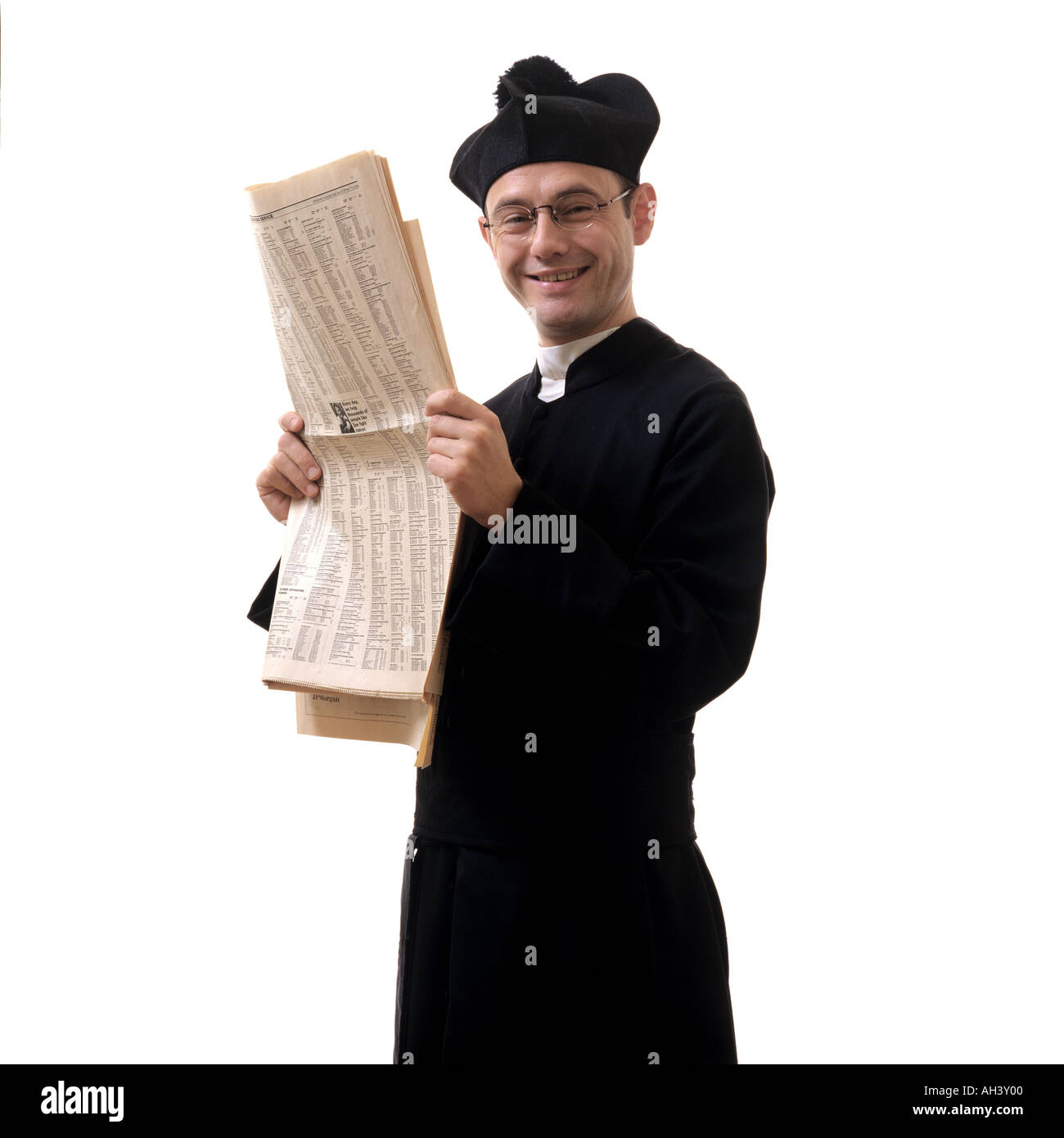 LAUGHING CATHOLIC PRIEST WITH A FINANCIAL NEWSPAPER Stock Photo - Alamy