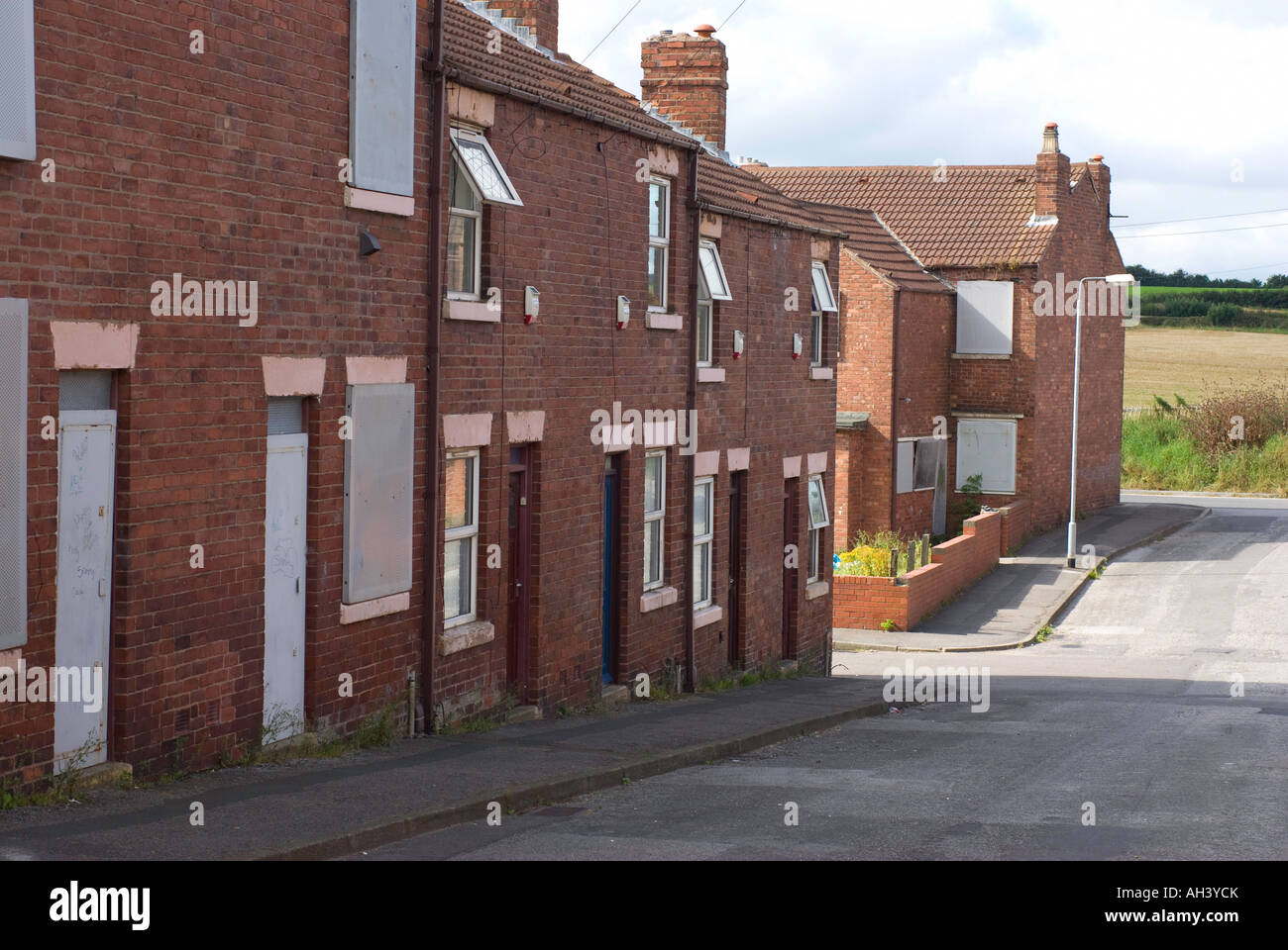 Depressed area with some terrace houses boarded up Stock Photo - Alamy
