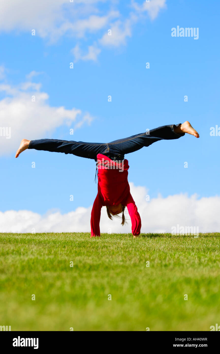 Girl doing a handstand Stock Photo - Alamy