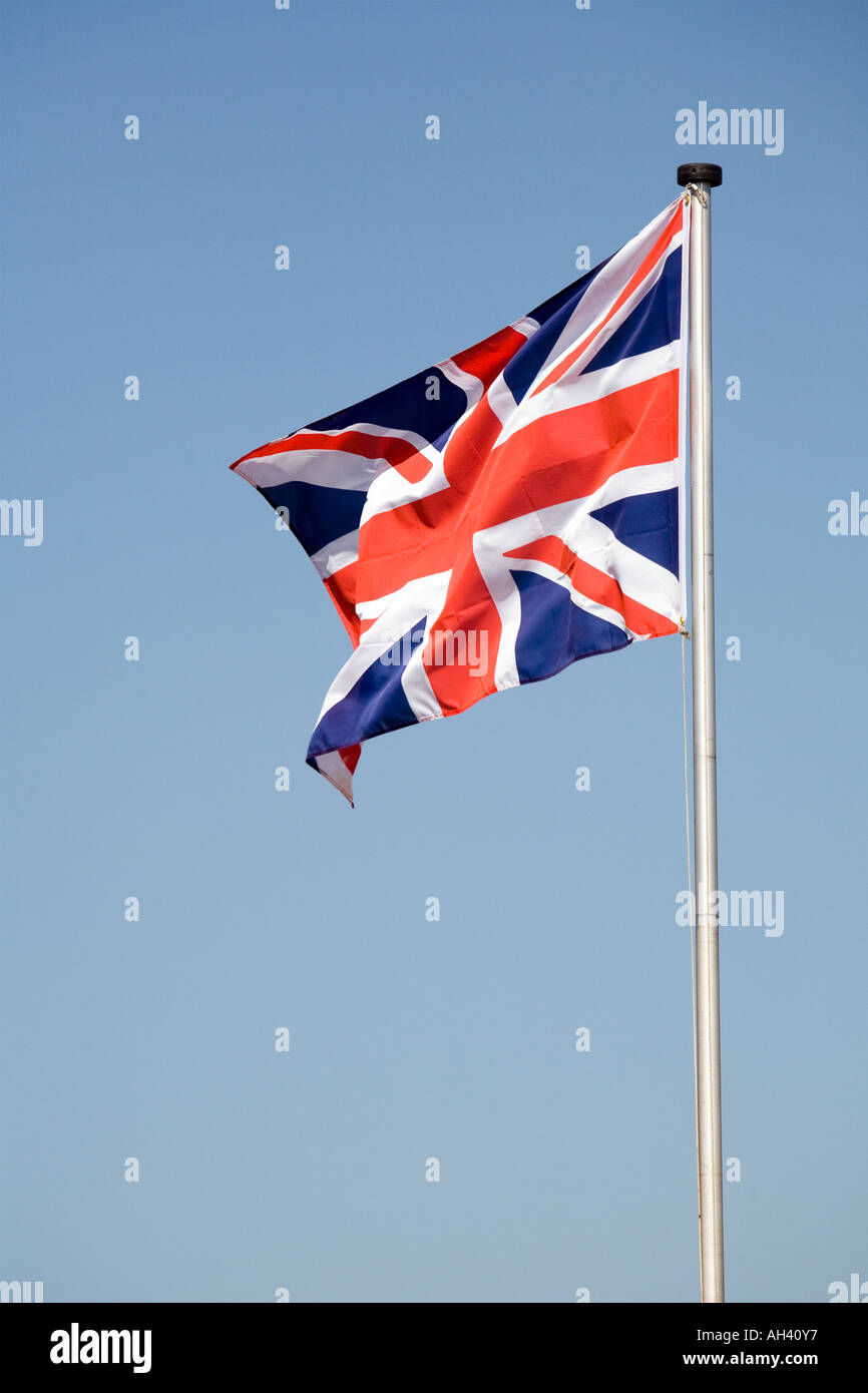 British Union Jack flying on white flag pole Stock Photo - Alamy