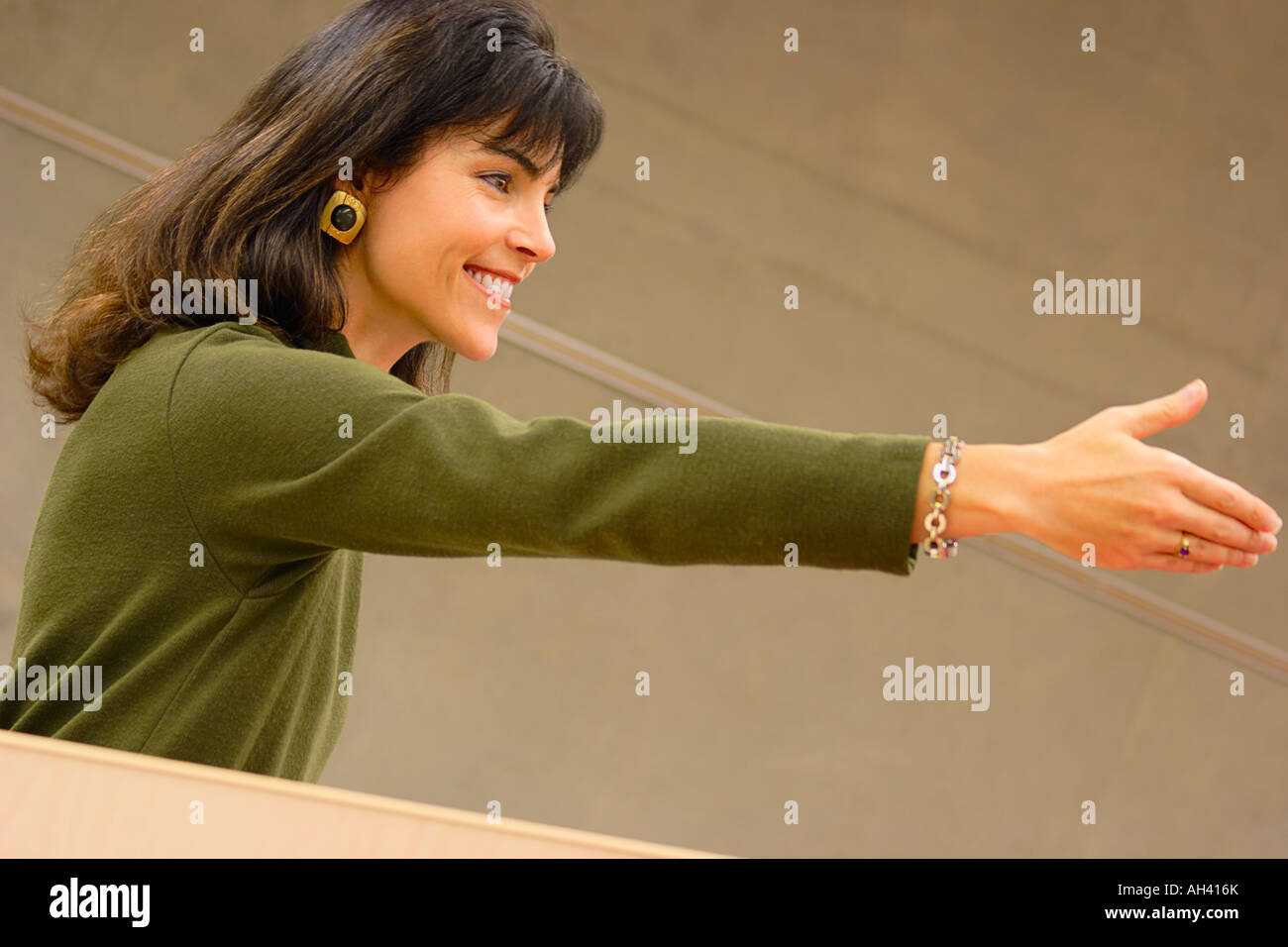 Woman reaching out her hand Stock Photo - Alamy