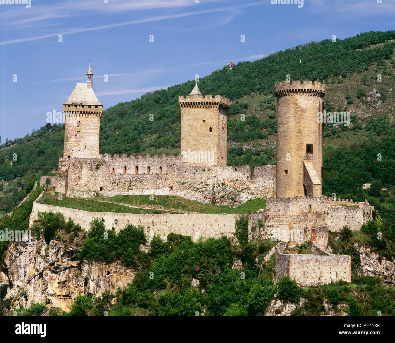 France castle on rock with mountain in background Stock Photo - Alamy