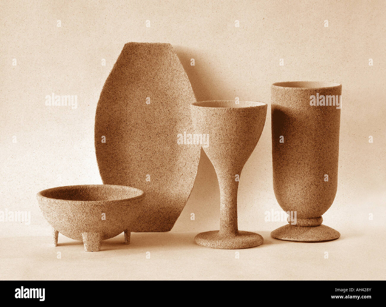 A classic still life image with four textured sepia colored objects ...