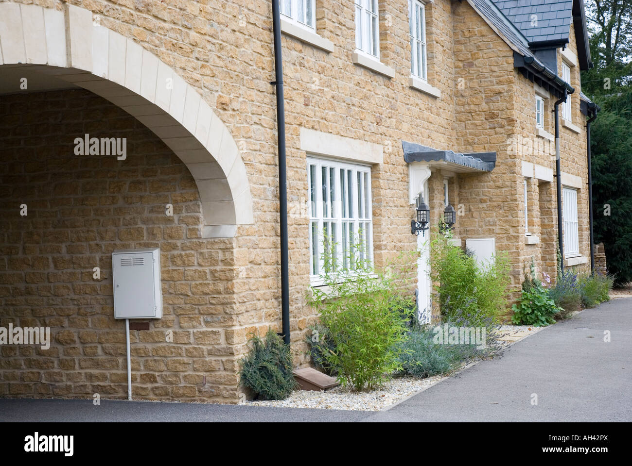 Modern terraced houses in Lamport village, Northamptonshire, England ...