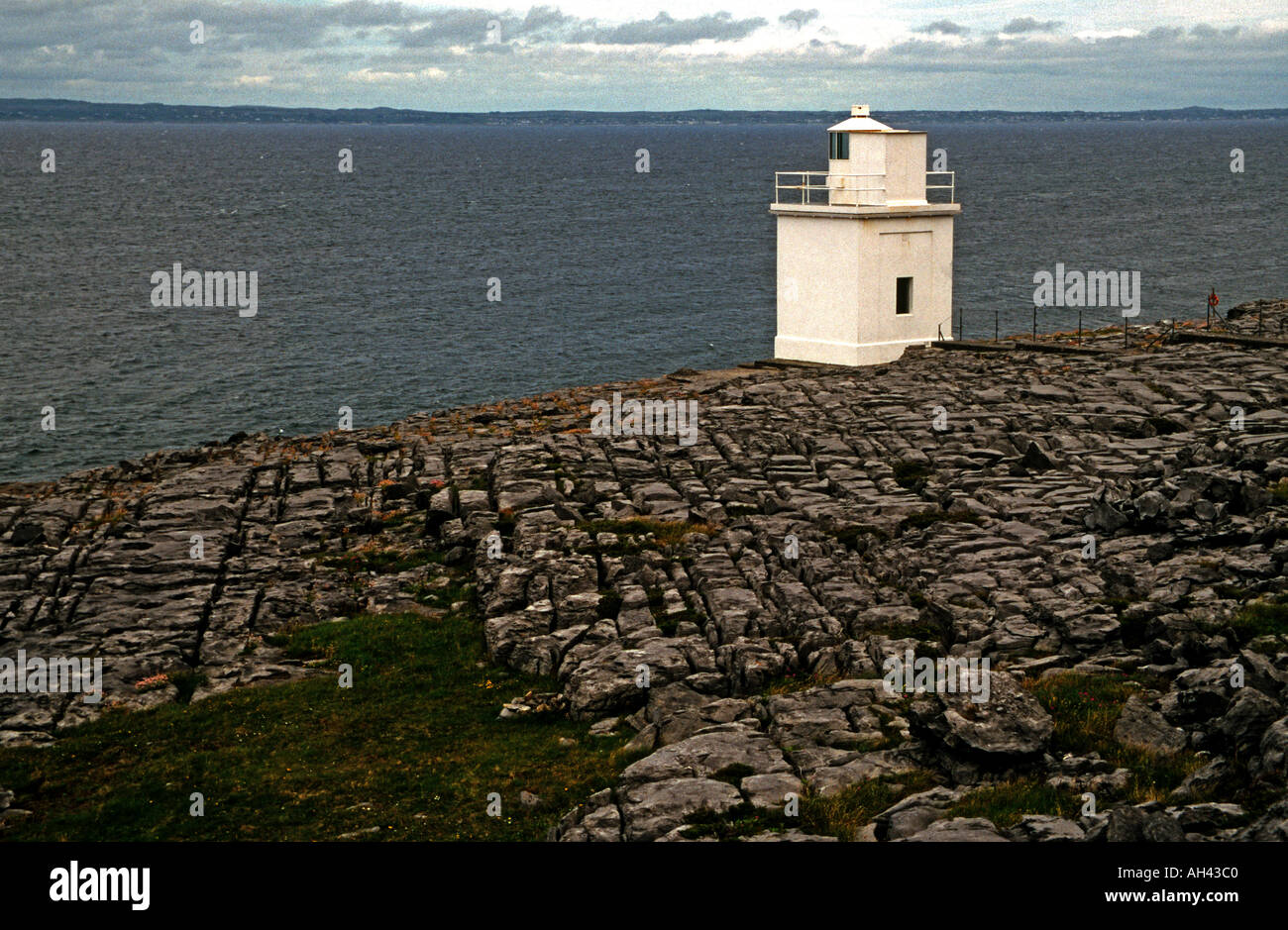 Cloudy sky over South Sound showing eroded rock formation The Burren ...