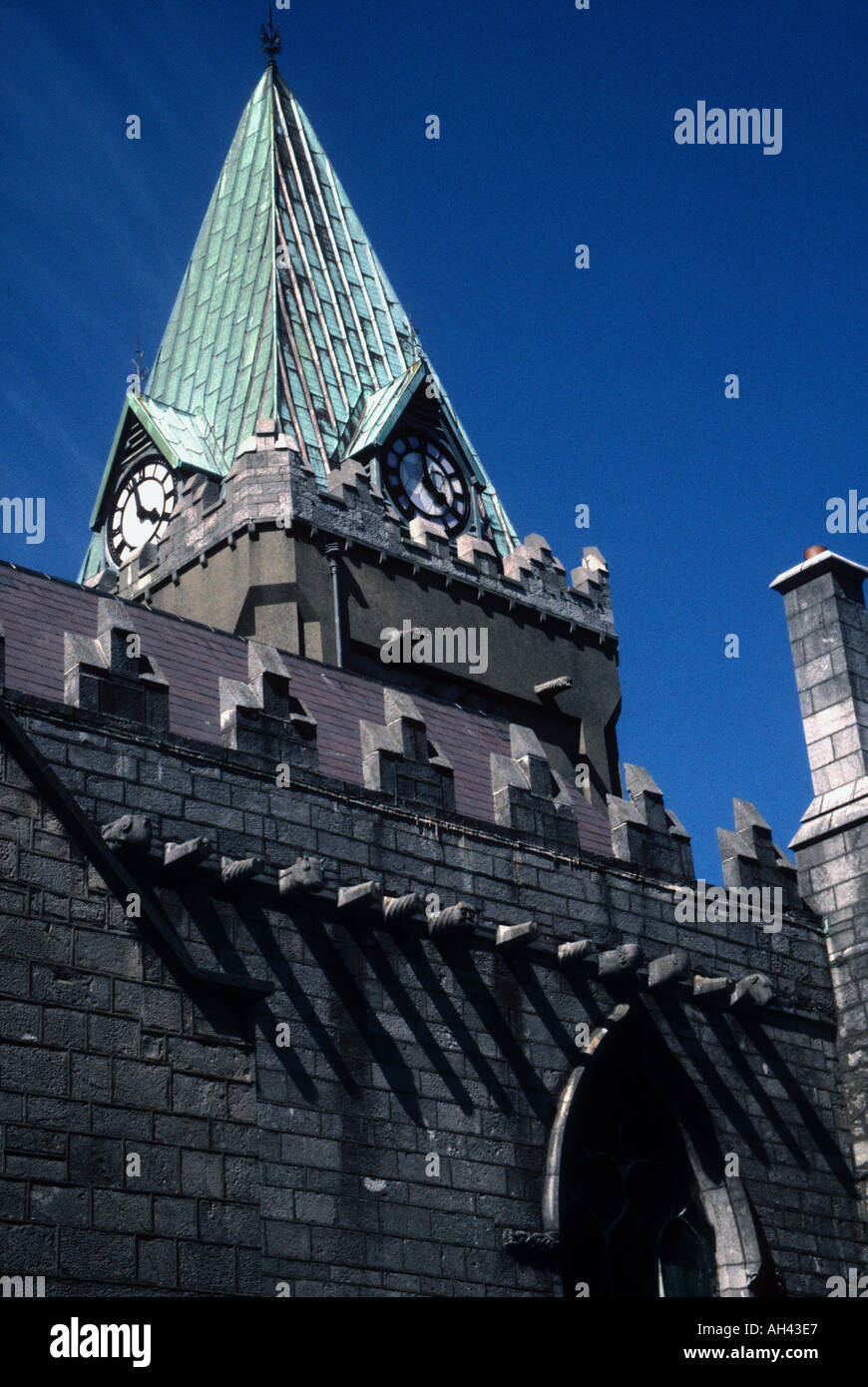Clock tower of medieval church against a deep blue sky Galway City ...