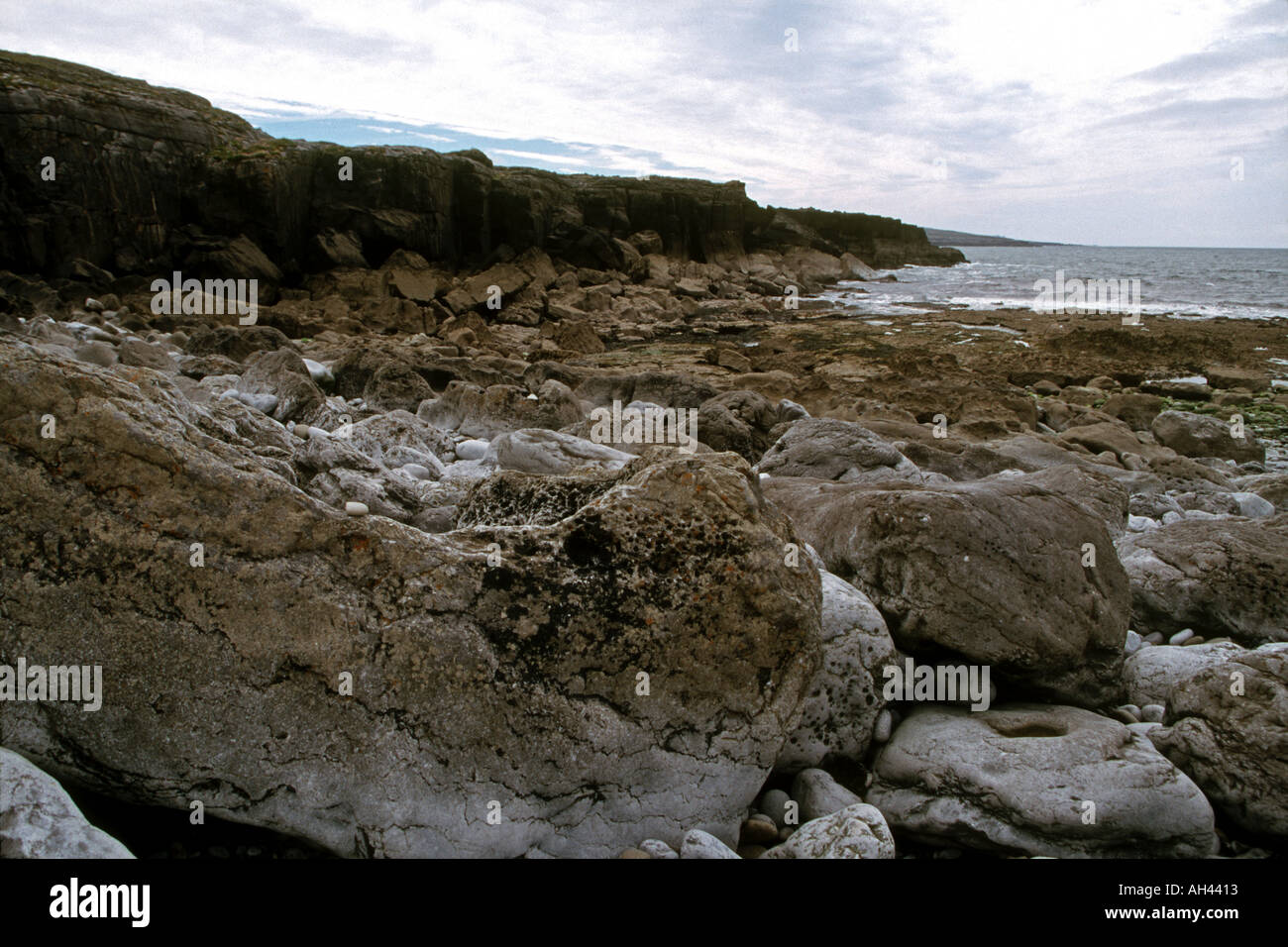 Grey boulders along the shore in the transitional area between The ...