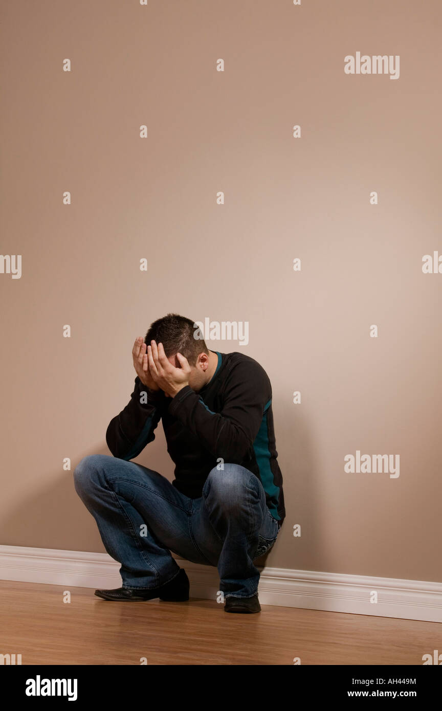 Man Crouching Scared High Resolution Stock Photography and Images - Alamy