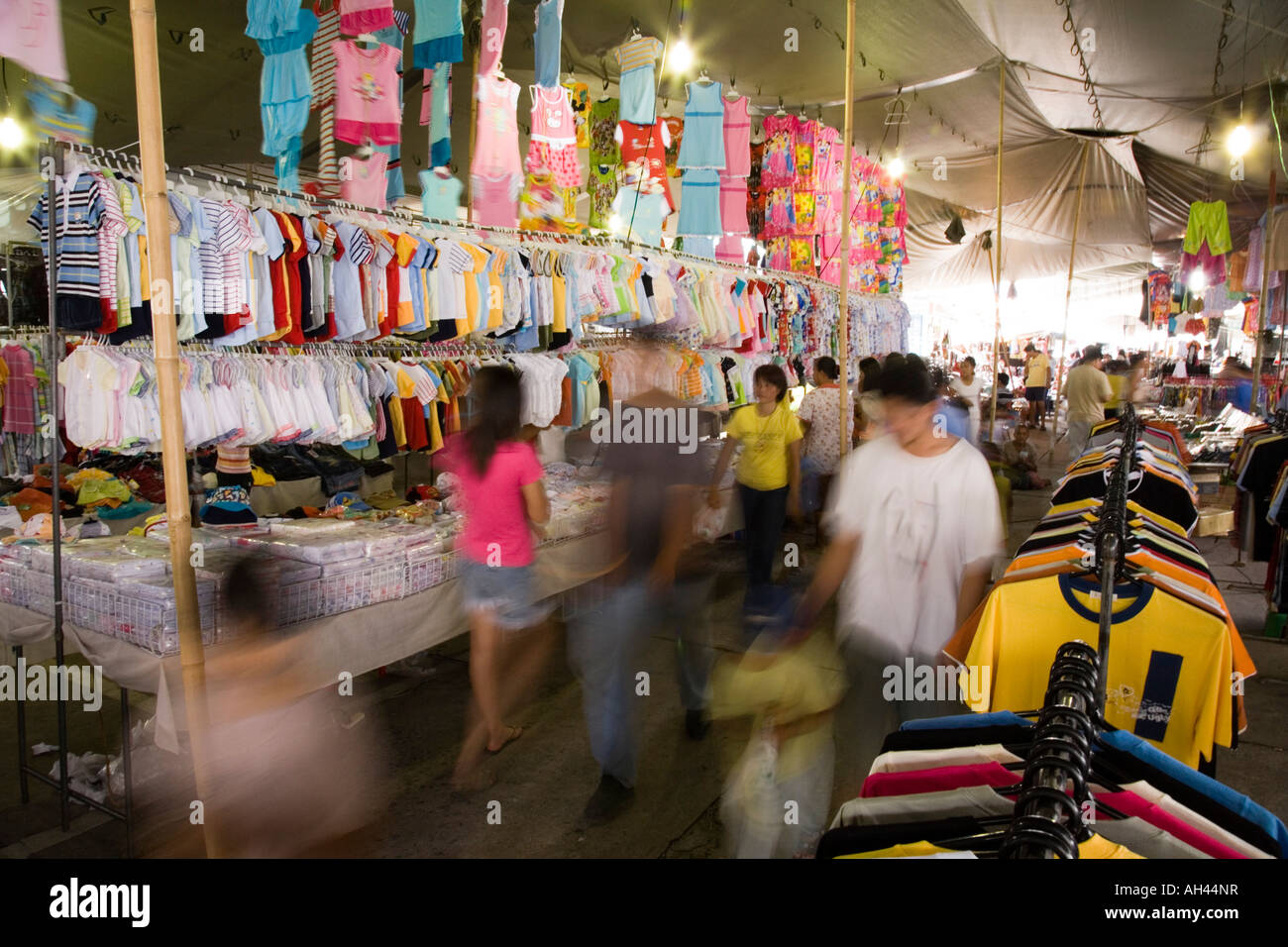 Kids outfitter / Street market stall selling children's clothes; T ...