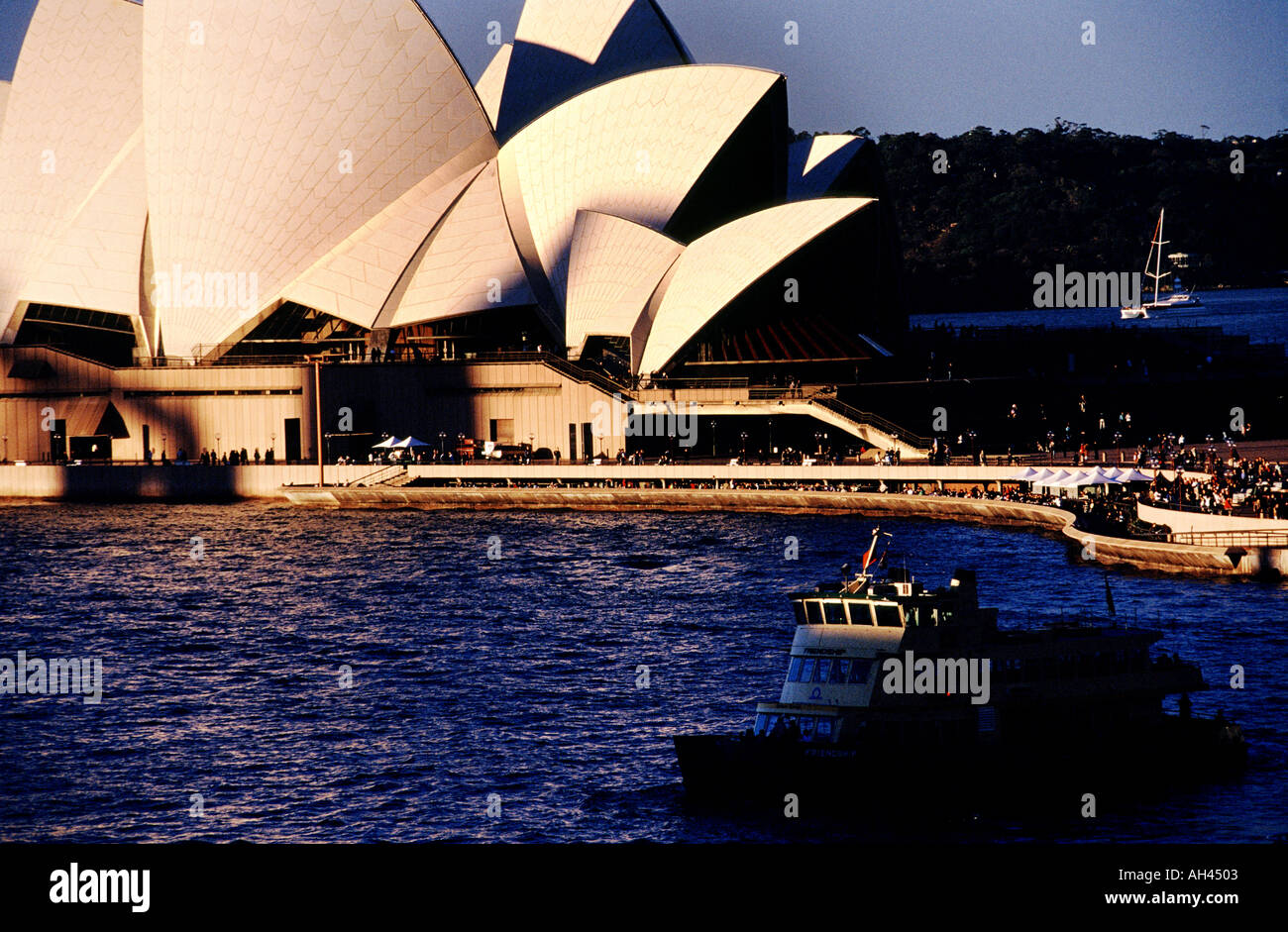 Famous landmark Sydney Opera House with a harbour ferry in the ...