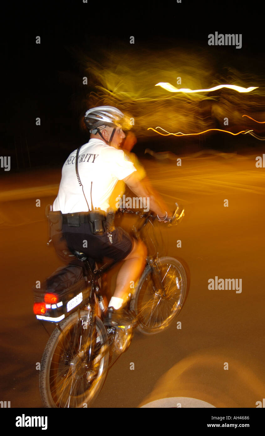Security guard on bicycle Stock Photo - Alamy