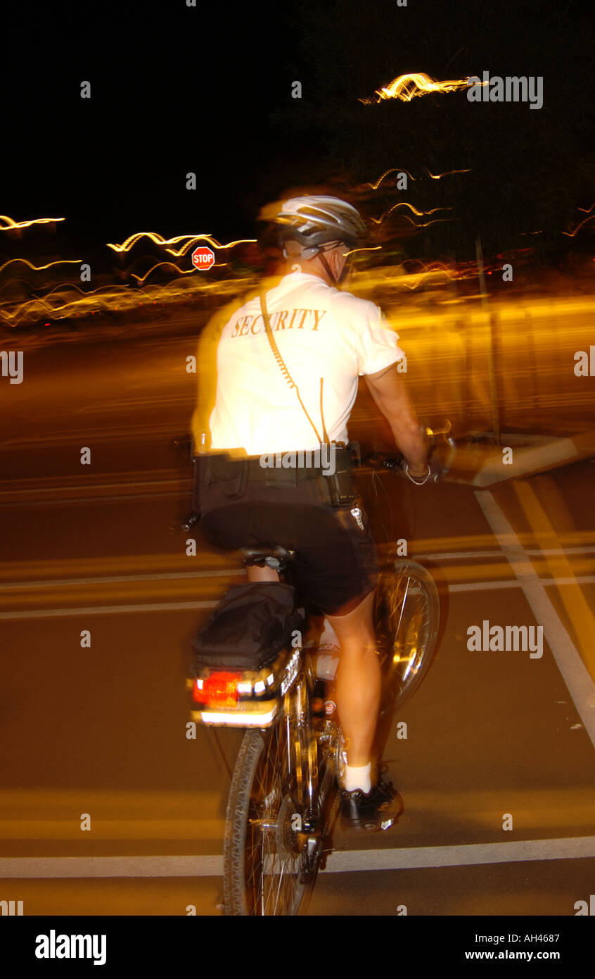 Security guard on bicycle Stock Photo - Alamy