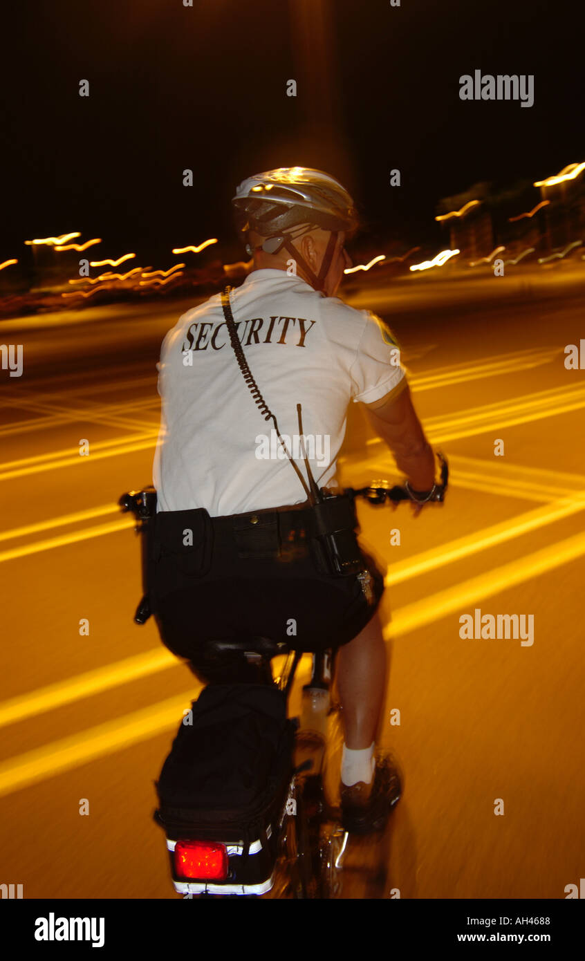 Security guard on bicycle Stock Photo - Alamy