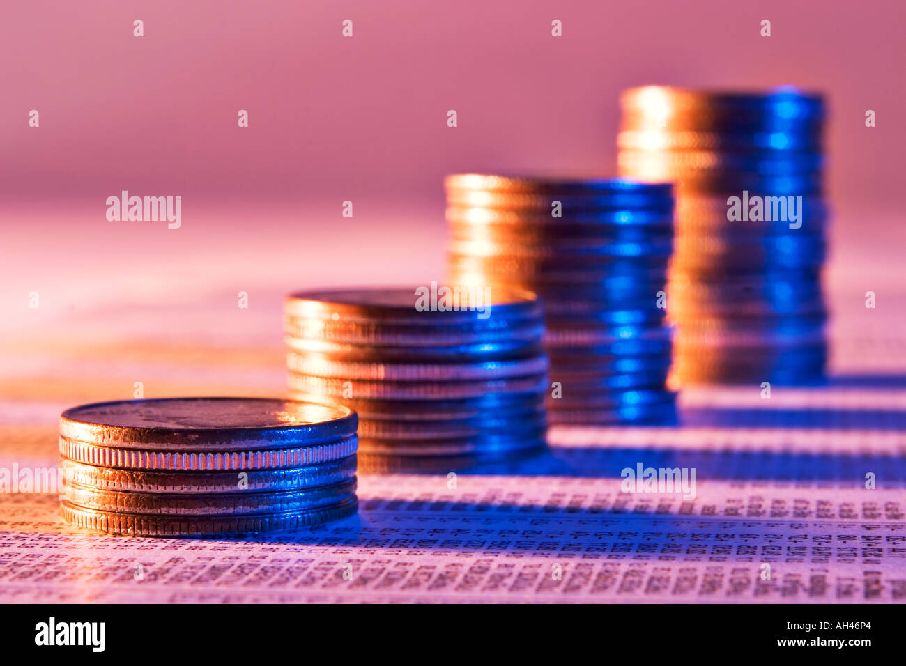 Coins stacked as a rising graph on stock report Stock Photo - Alamy