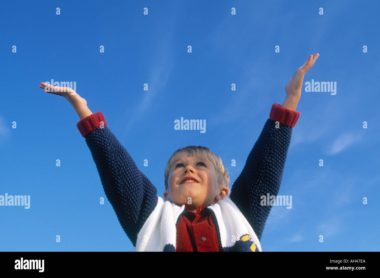 Boy reaching blonde hi-res stock photography and images - Alamy