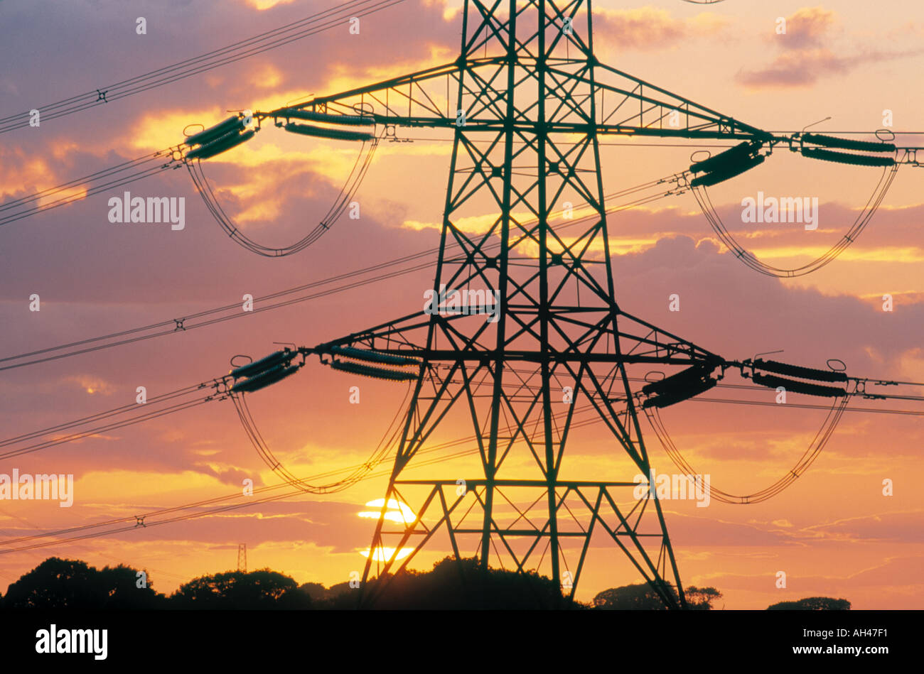 An electricity pylon of the National Grid in Wales at sunset Stock ...