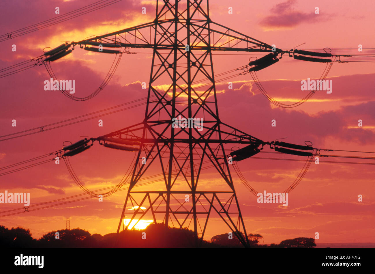 An electricity pylon of the National Grid in Wales at sunset Stock ...