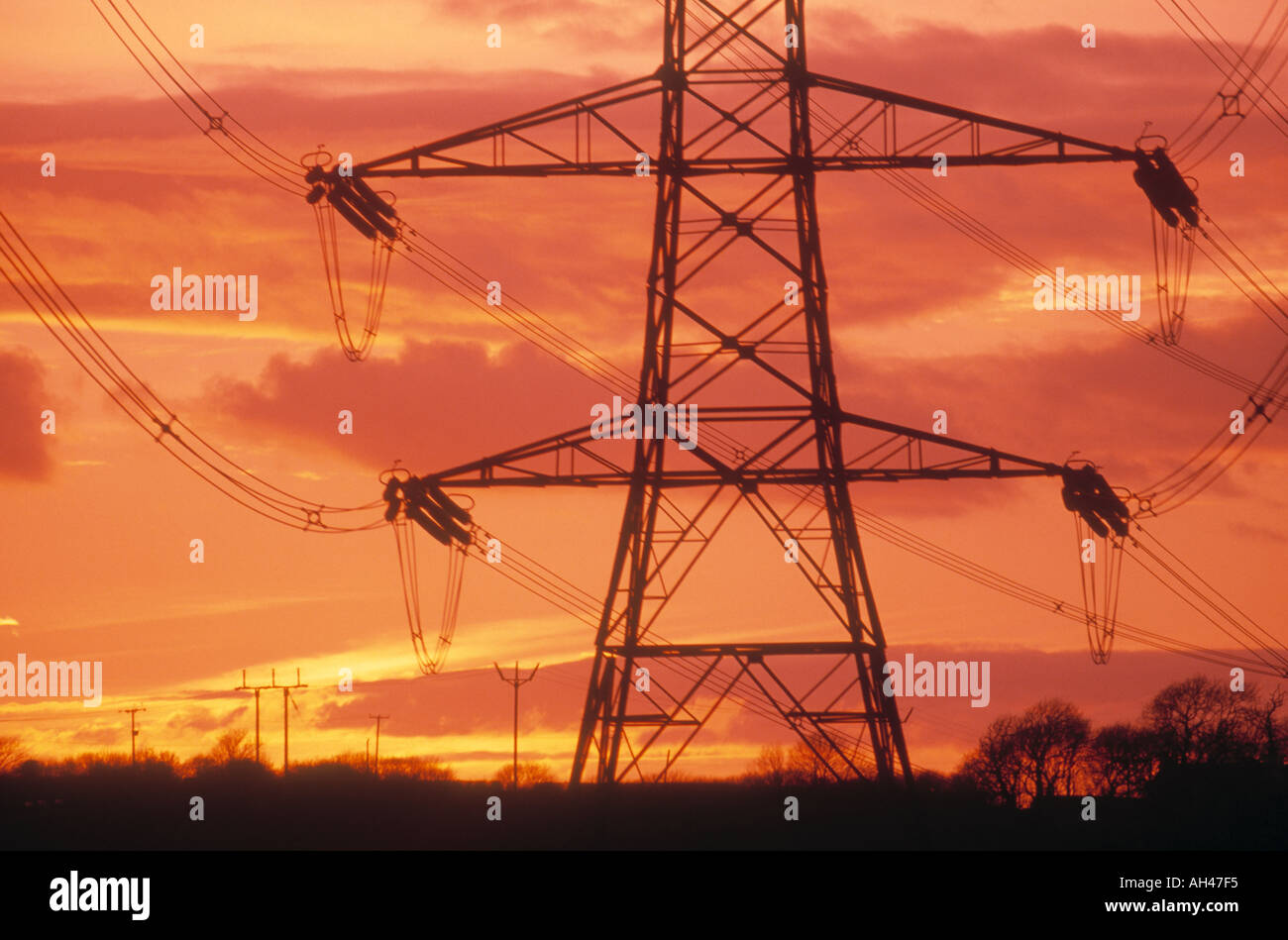 An electricity pylon of the National Grid in Wales at sunset Stock ...