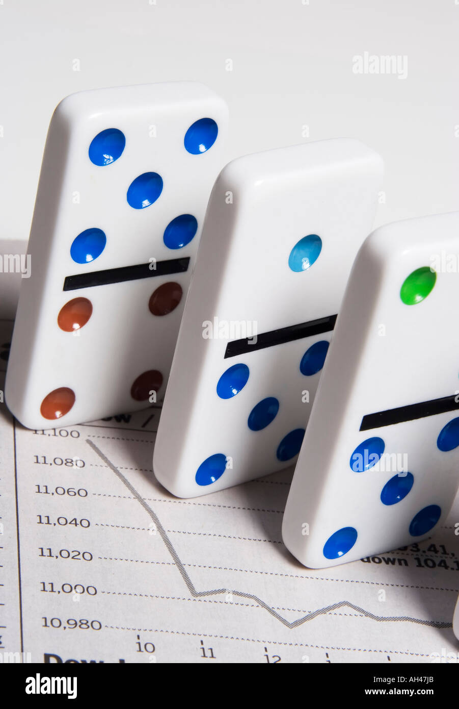 Domino and stock report graph Stock Photo - Alamy