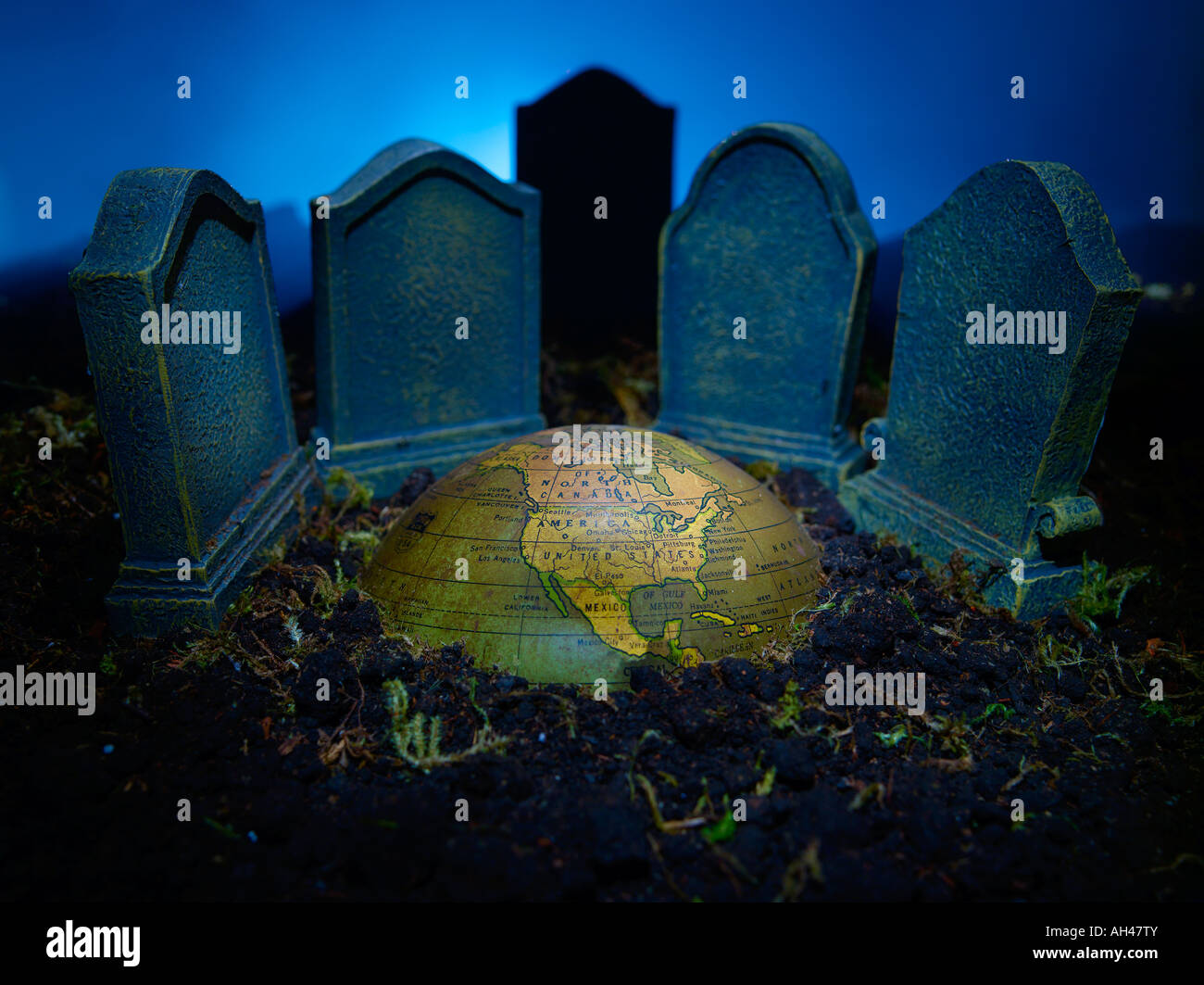 Buried earth globe Stock Photo - Alamy