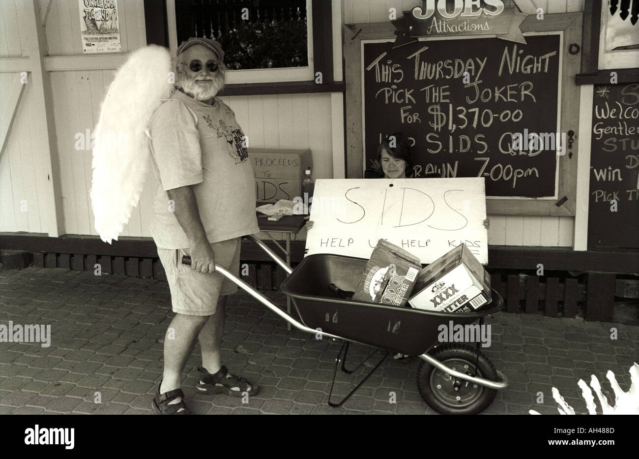 series angel raffle ticket seller eumundi markets 2080 Stock Photo - Alamy