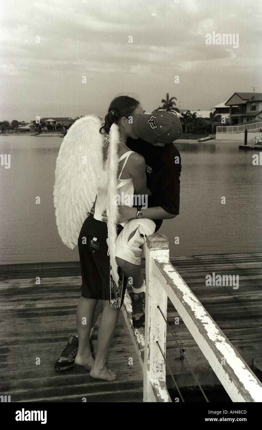 series angel girl and boyfriend kissing on jetty 2088 Stock Photo - Alamy