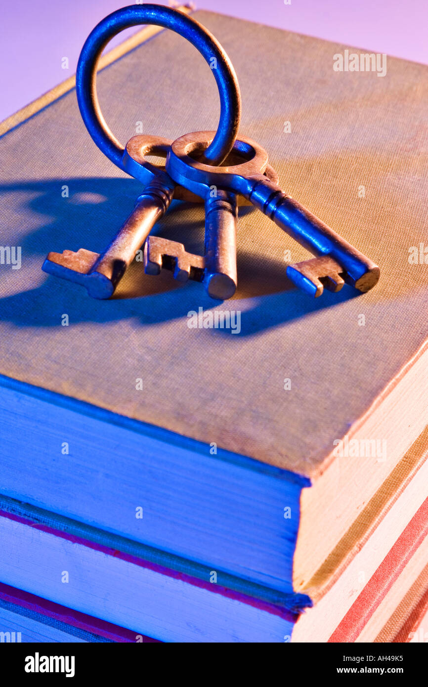 Antique keys on an old book Stock Photo - Alamy