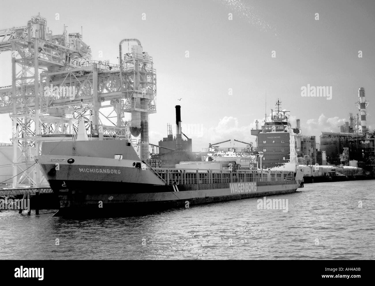 Cargo ship navigating the Savannah River, Georgia, USA, with a scenic ...