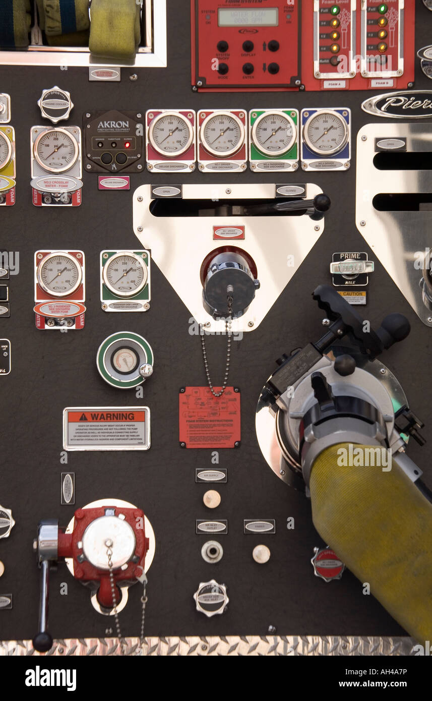A close-up view of the high-tech dials, gages and hoses on a fire truck ...