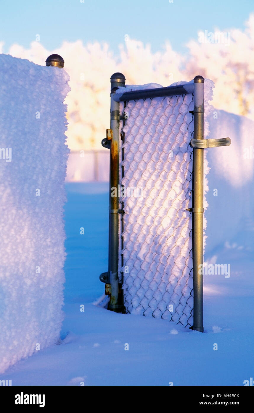 Gate covered with snow Stock Photo - Alamy