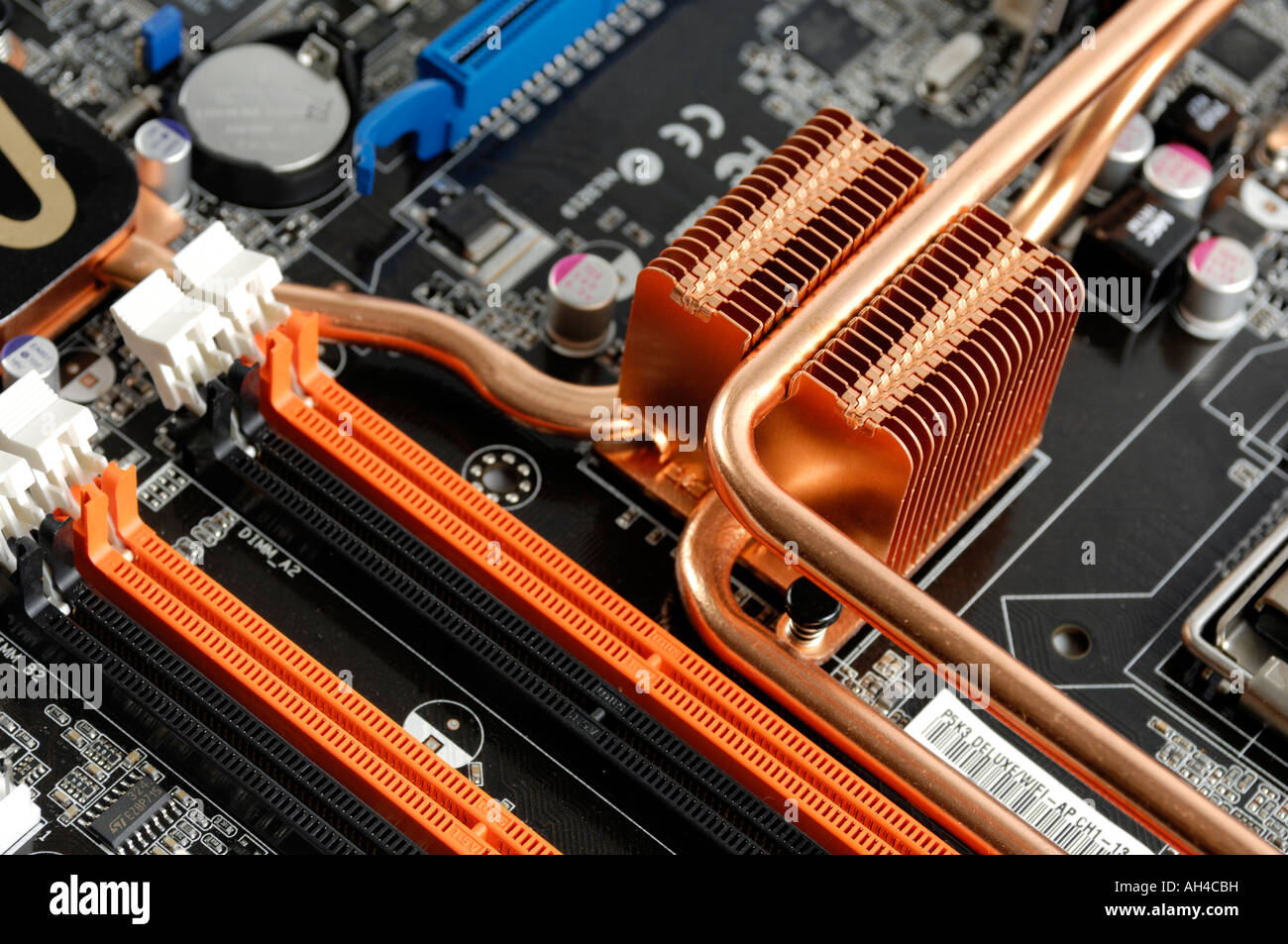 Computer motherboard closeup with large copper reflectors Stock Photo ...