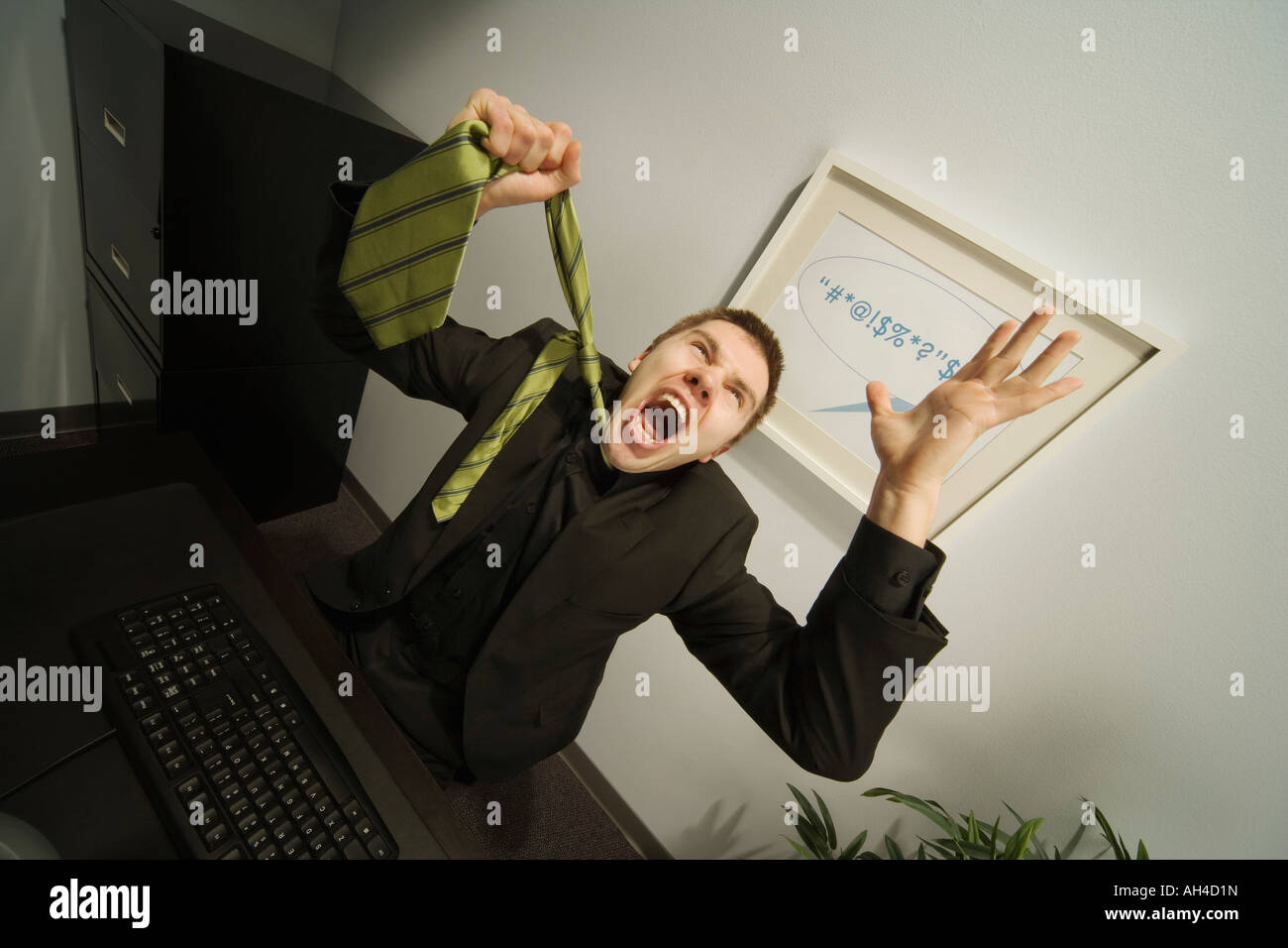 Businessman frustrated in office Stock Photo - Alamy