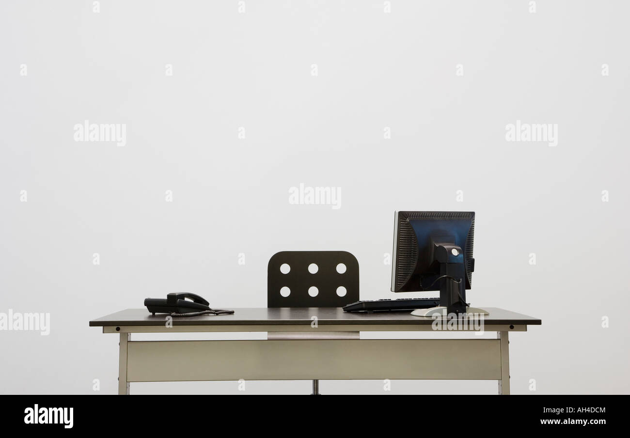 Office desk with computer and phone Stock Photo - Alamy
