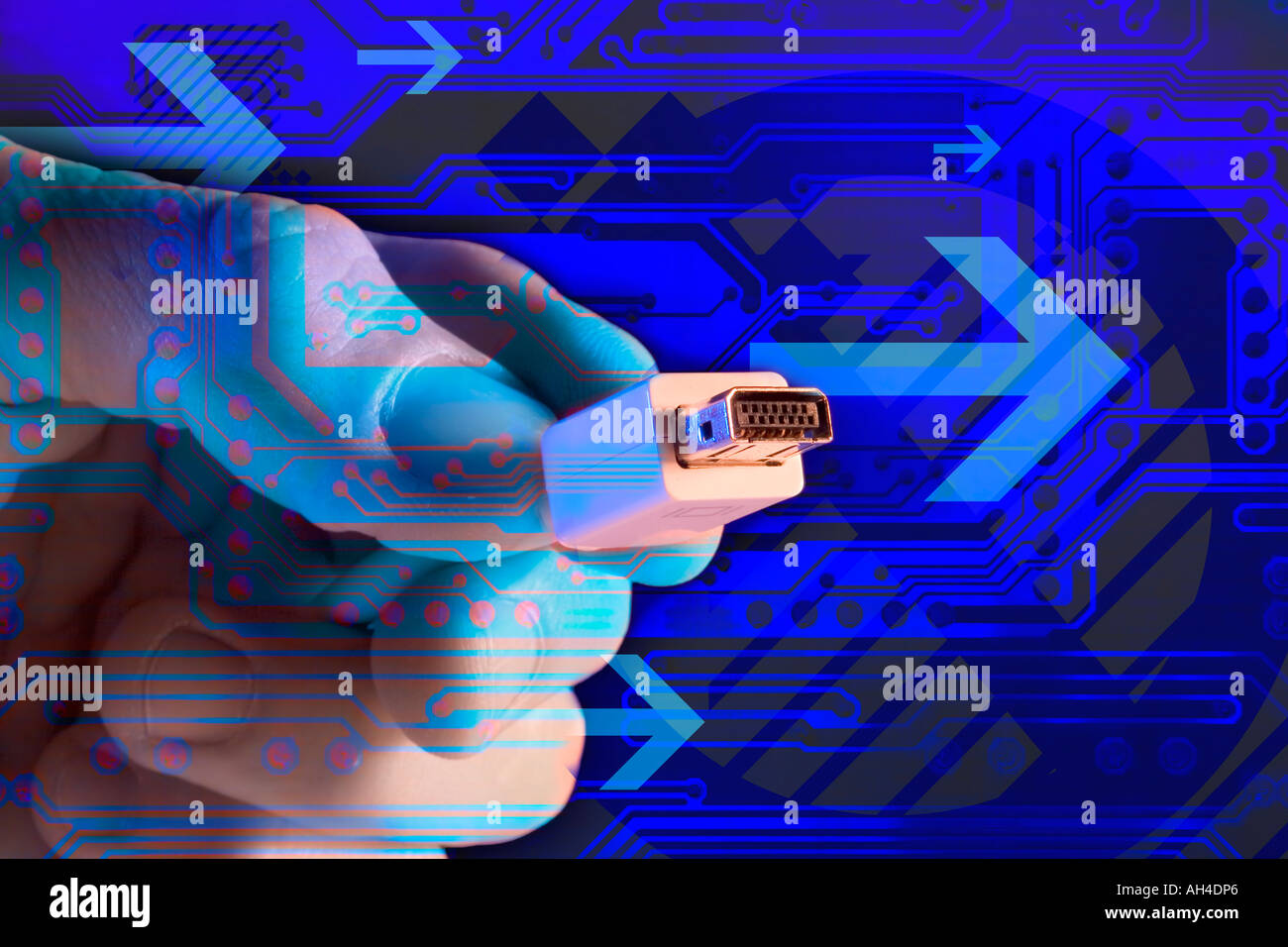 Composite of a Hand holding a computer cord Stock Photo - Alamy