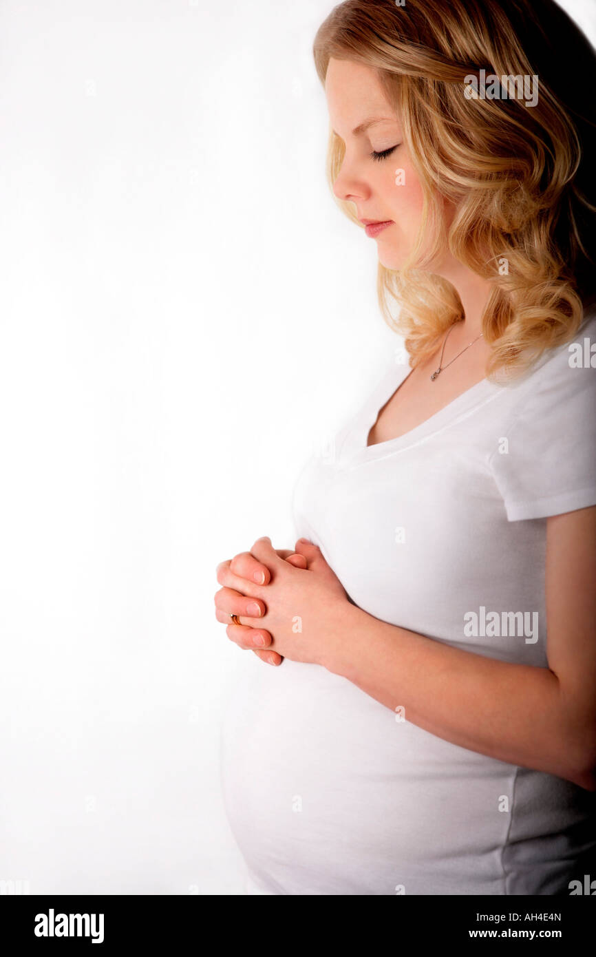 Pregnant mother praying Stock Photo - Alamy