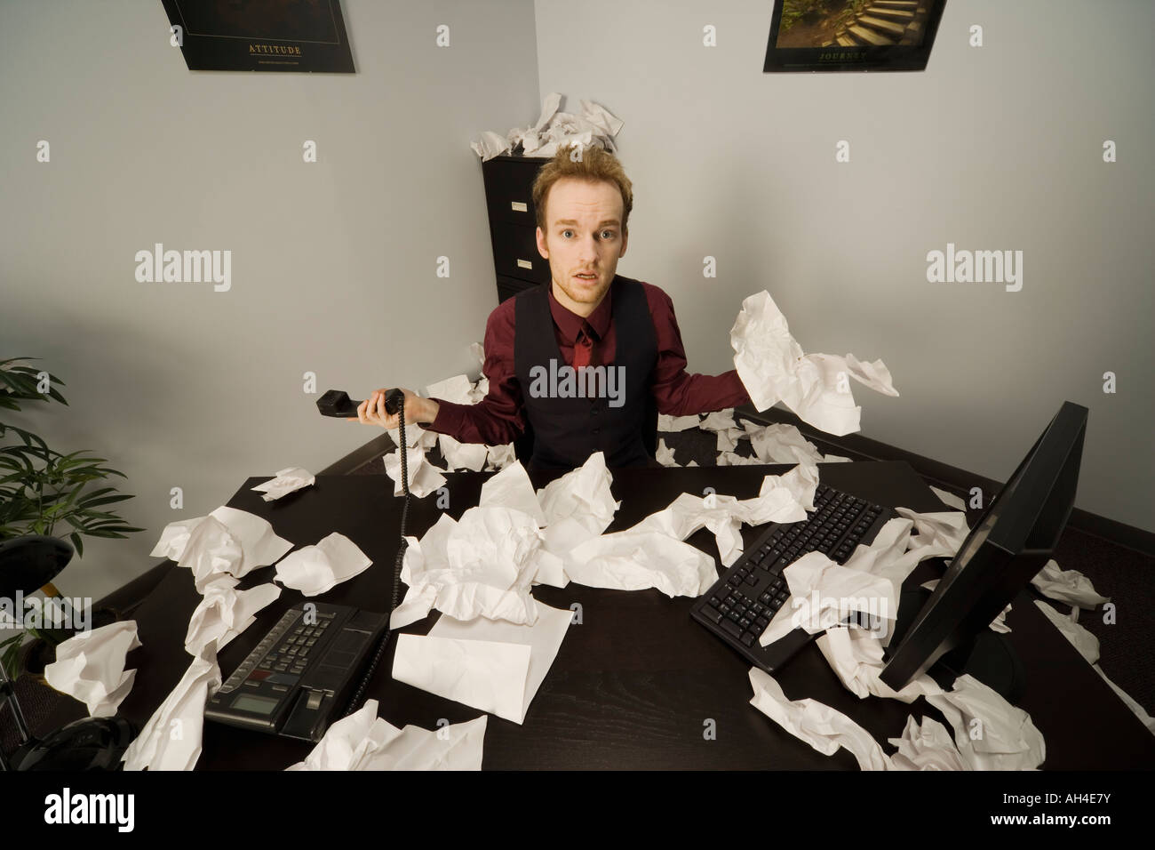 Businessman at messy desk Stock Photo - Alamy