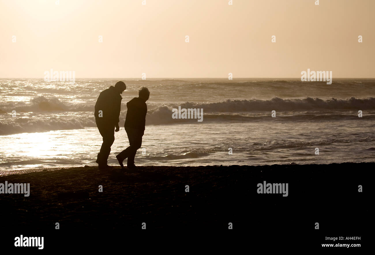 Strolling Against the Wind Stock Photo - Alamy
