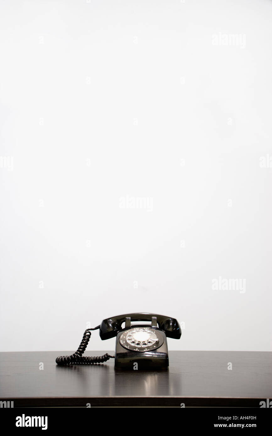 Telephone on desk Stock Photo - Alamy