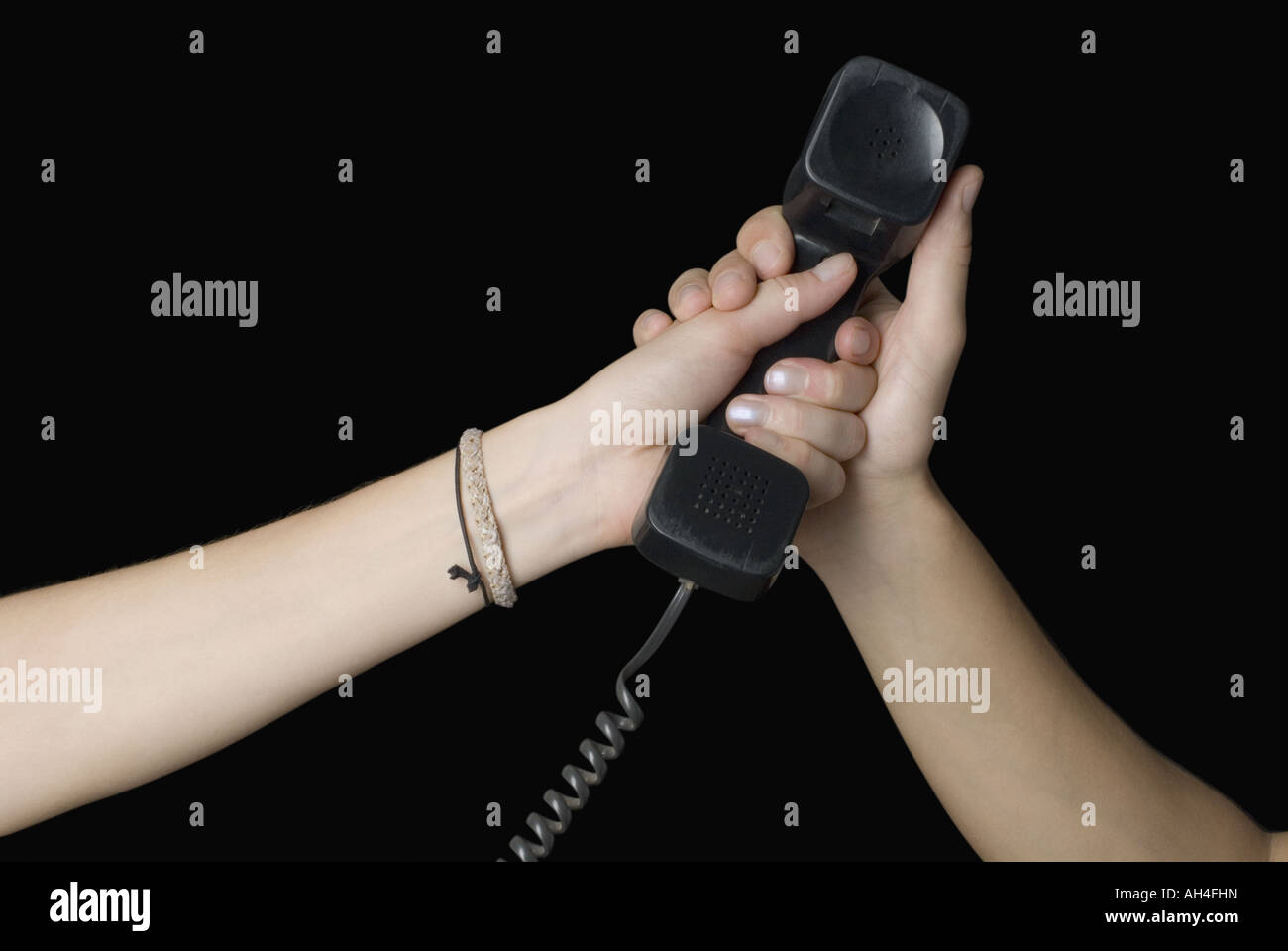 Human hand holding telephone cord hi-res stock photography and images ...