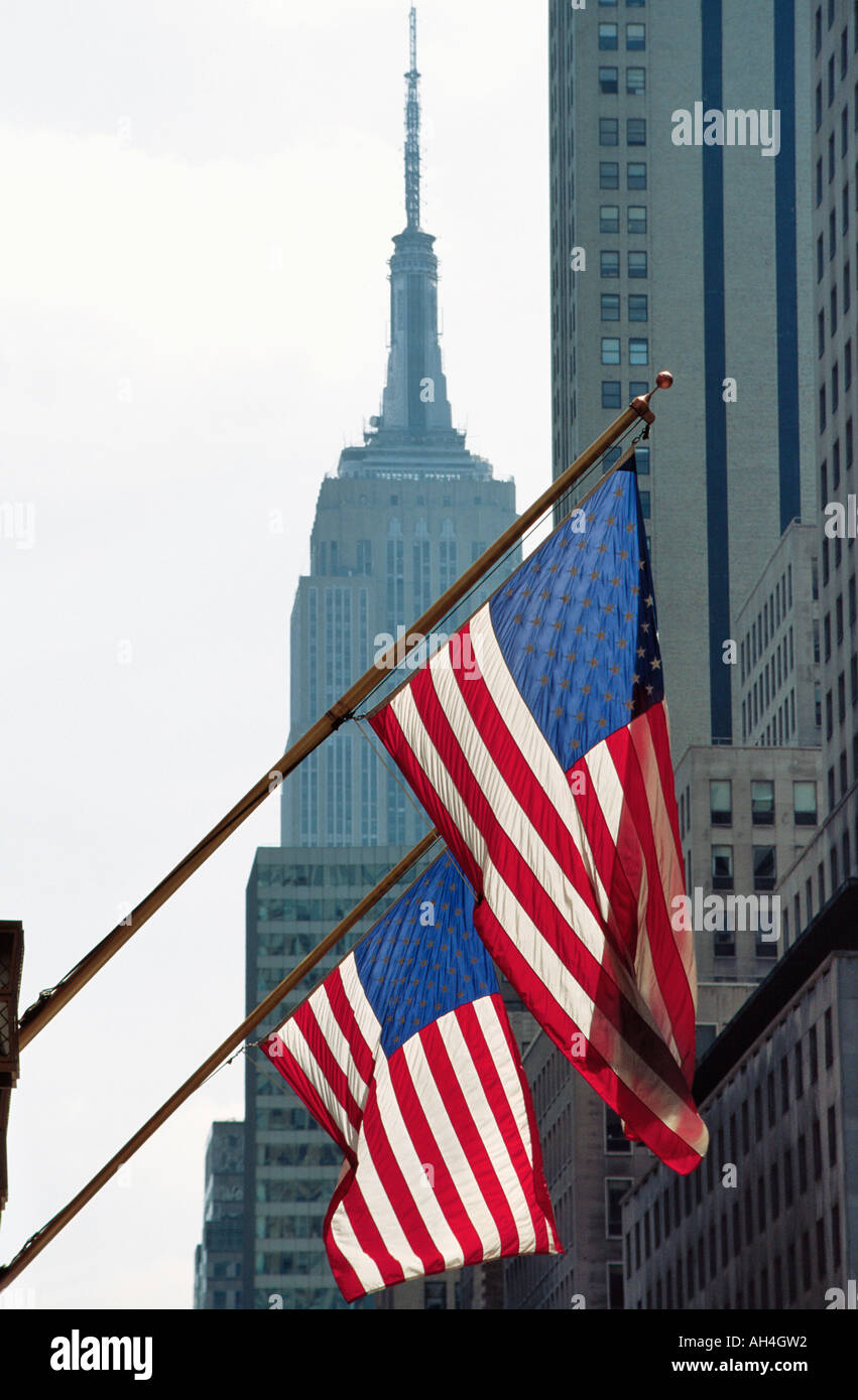 american flags and Empire State Building, New York City, USA Stock ...