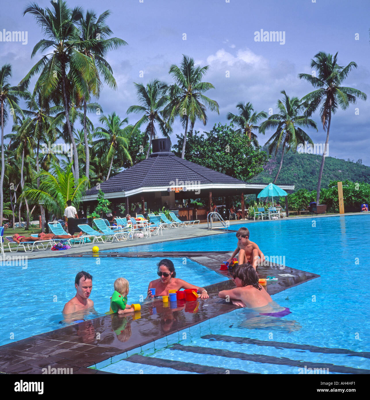 Tourists hotel swimming pool mahe Seychelles Stock Photo - Alamy