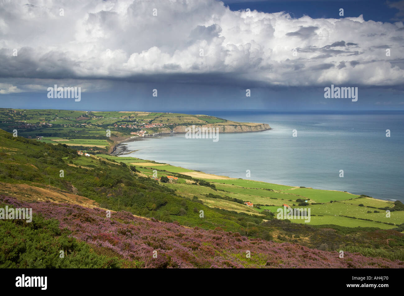 Summer storm over Robin Hoods Bay from Ravenscar North Yorkshire Moors ...