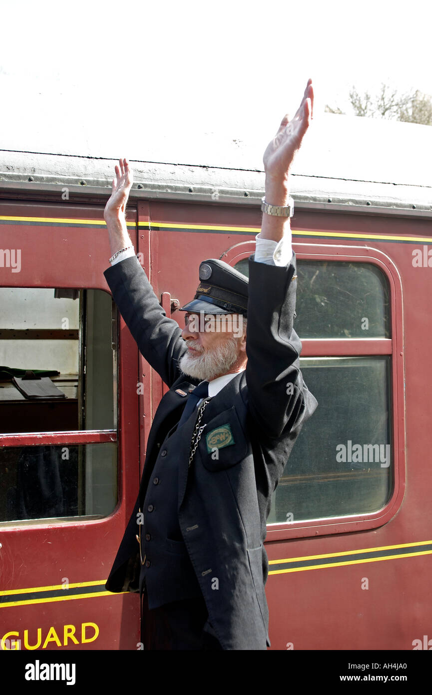 Steam Train guard signalling on Bodmin and Wenford Railway Cornwall ...