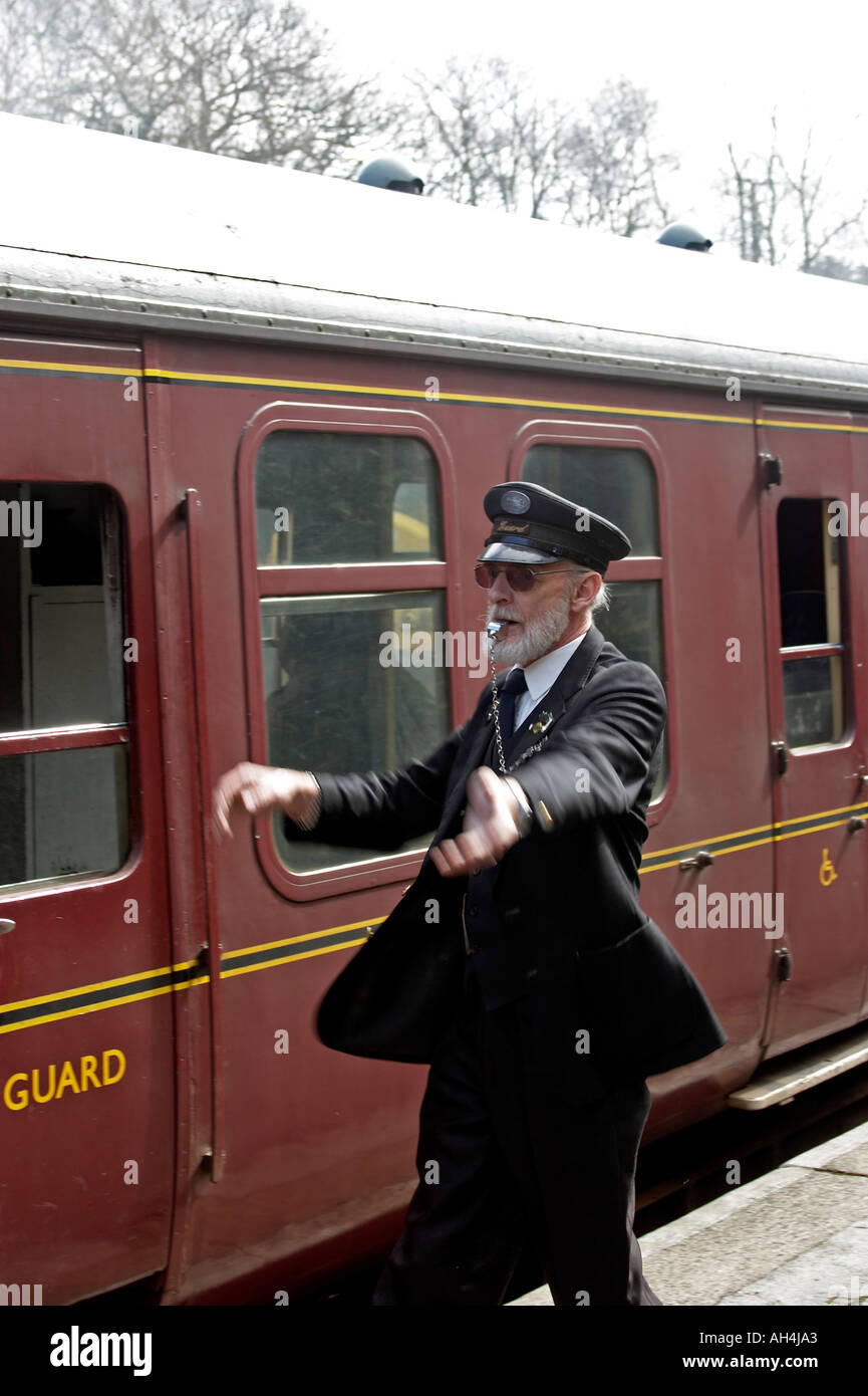 Steam Train guard signalling on Bodmin and Wenford Railway Cornwall ...