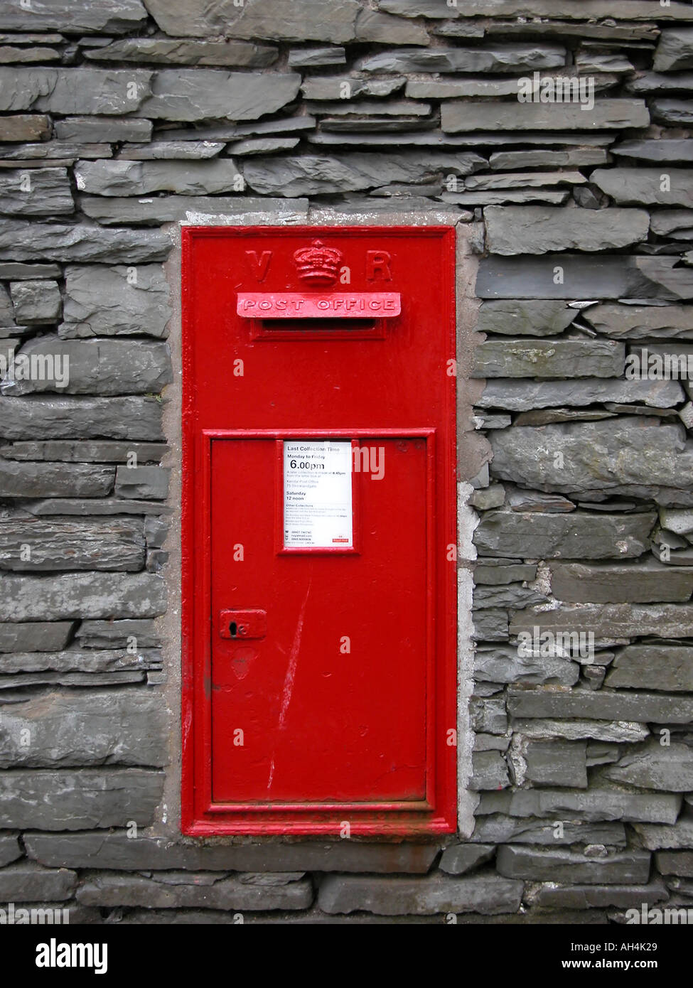 Post box from Victorian times installed in a dry grey wall England ...