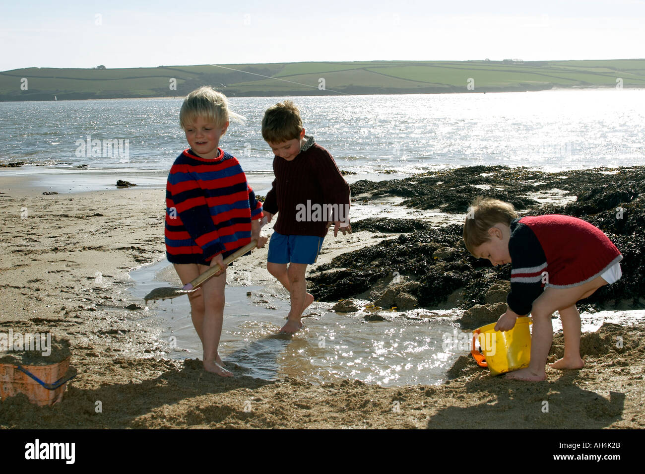 Children playing in the sand and sea on Daymer Beach near Rock Cornwall ...