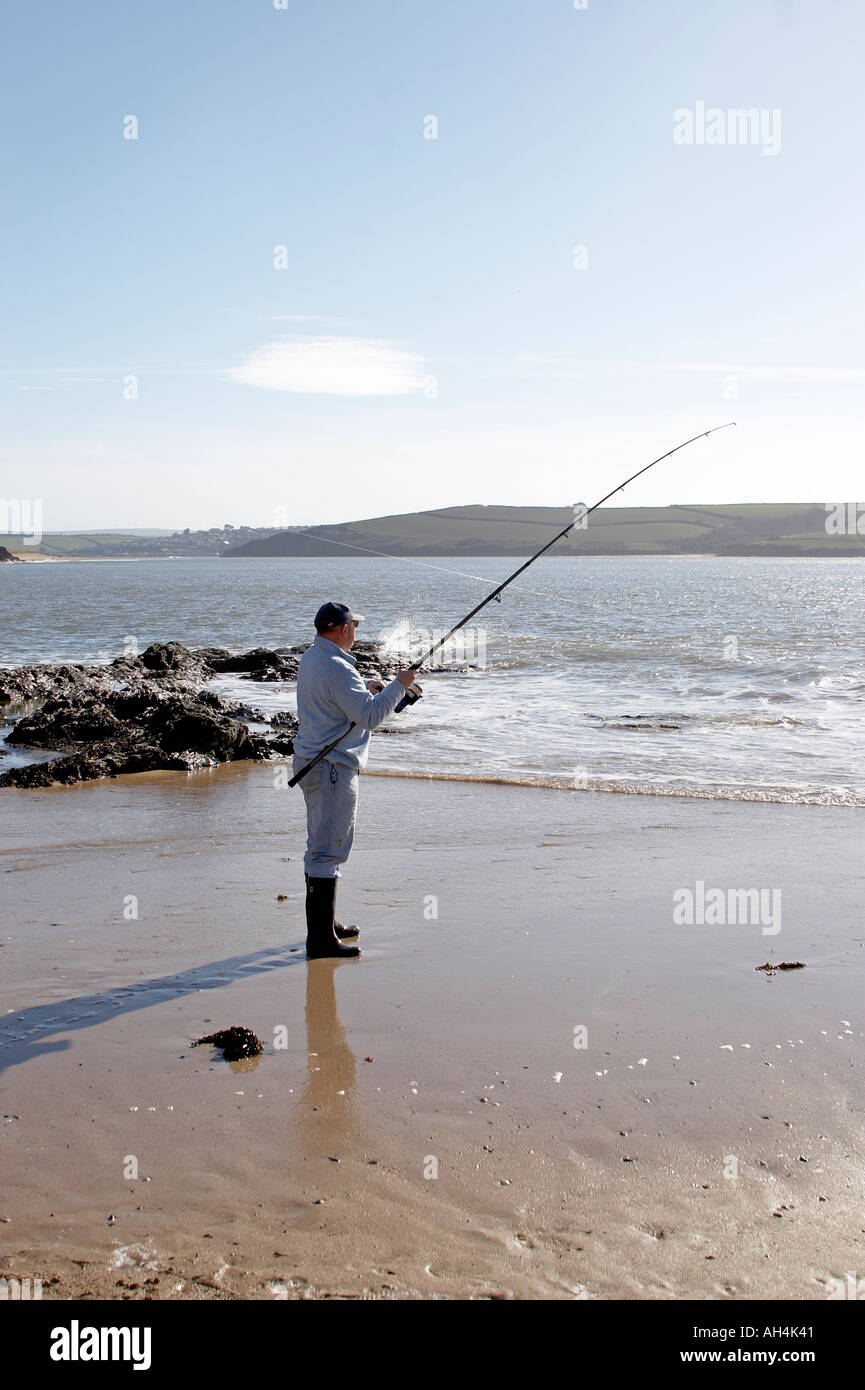 Fisherman beach fishing in the sea on Daymer Beach near Rock Cornwall ...