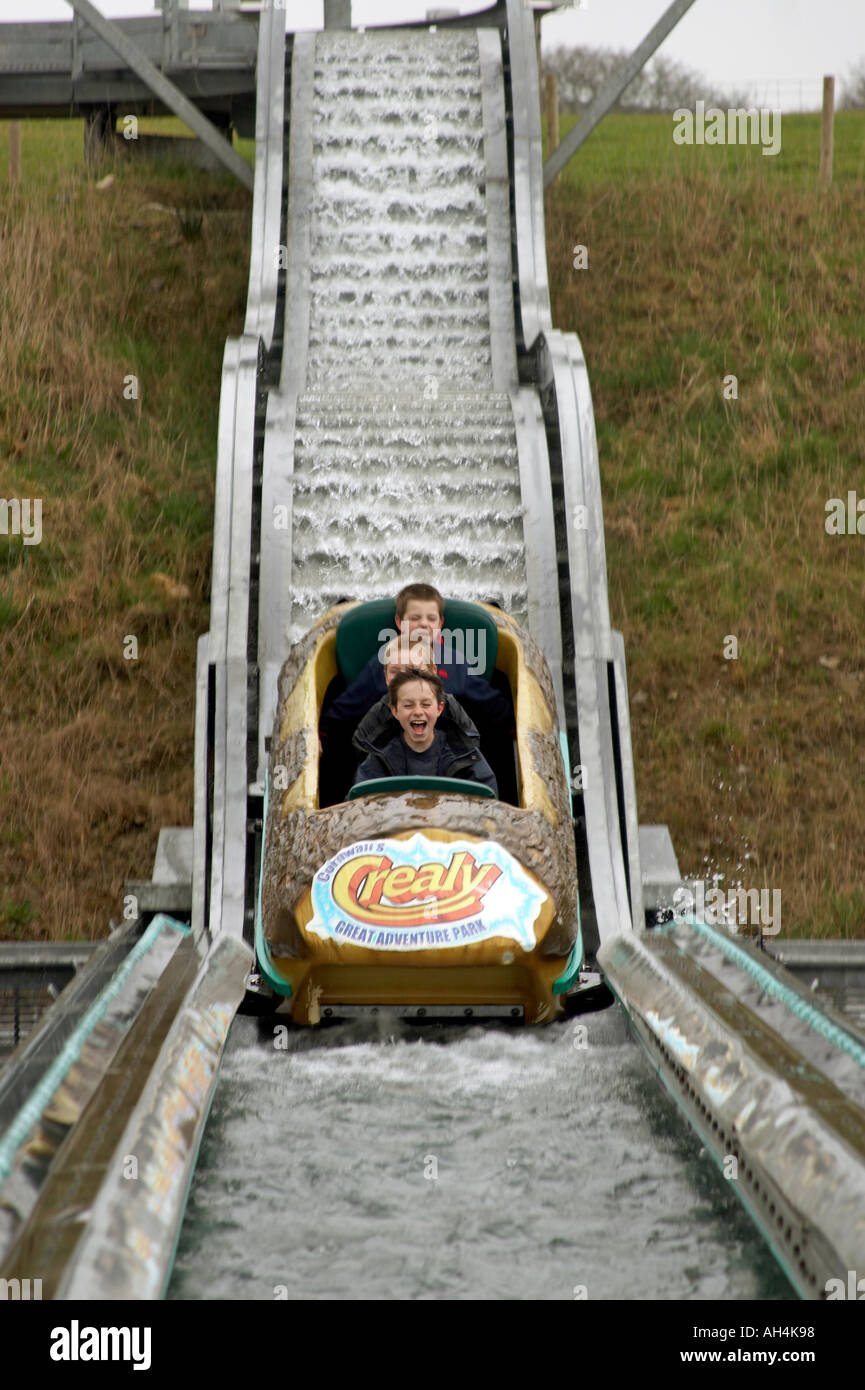 Boys laughing in water flume ride in Crealy Adventure Park Cornwall ...