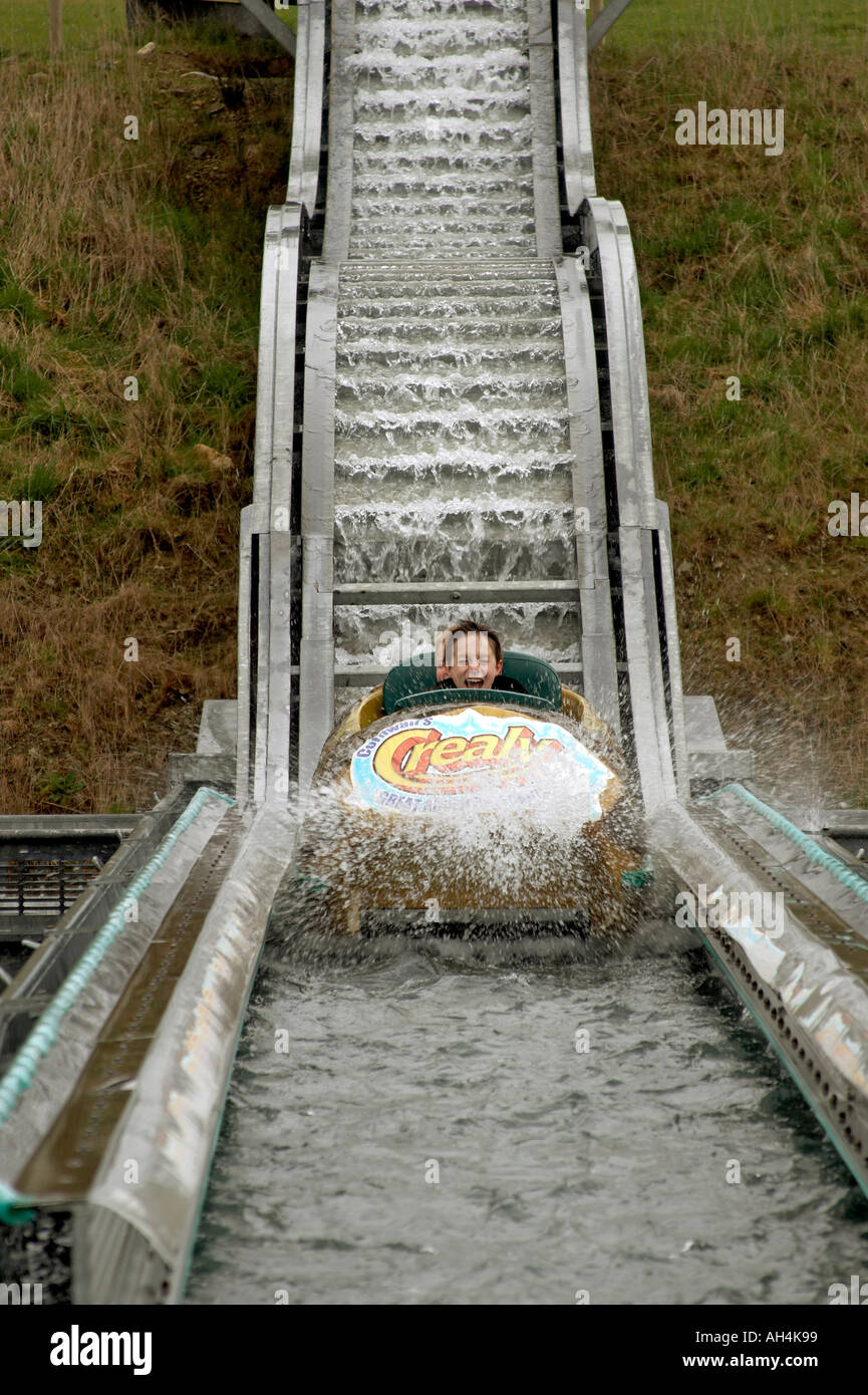 Boys laughing in water flume ride in Crealy Adventure Park Cornwall ...