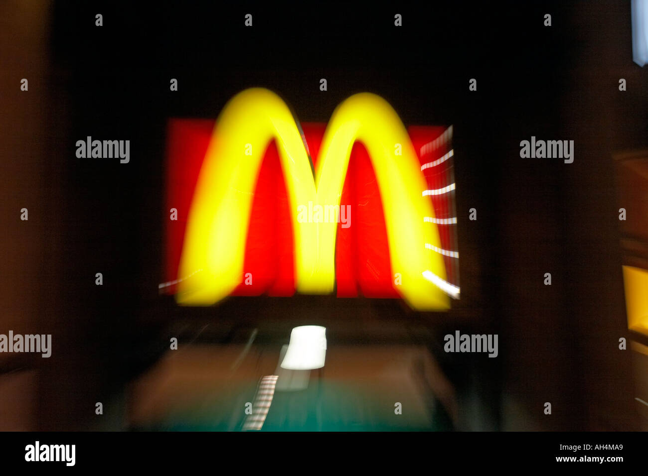 Macdonalds big M logo sign in neon at night with zoom effect London W1 ...